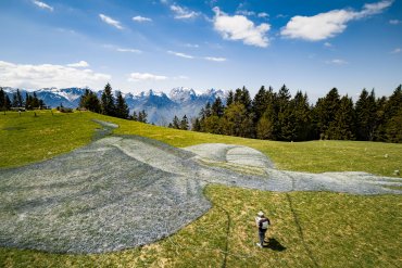 About artist Saype who's painting the Swiss landscape
