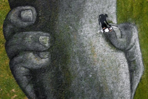 About artist Saype who's painting the Swiss landscape